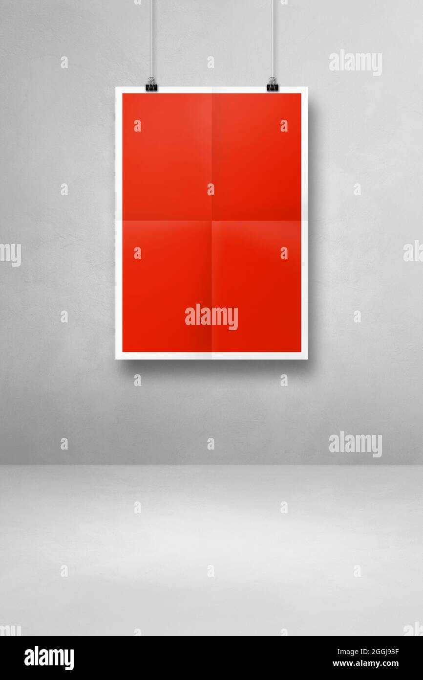 red folded poster hanging on a white wall with clips. Blank mockup ...