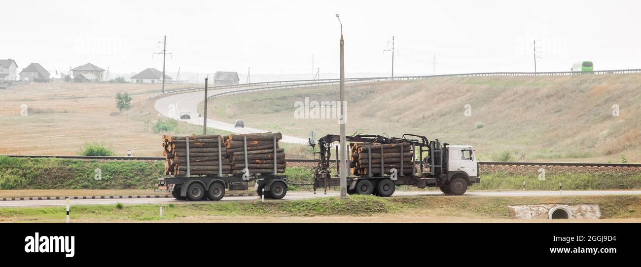 Logging machine transports logs stack hi-res stock photography and ...