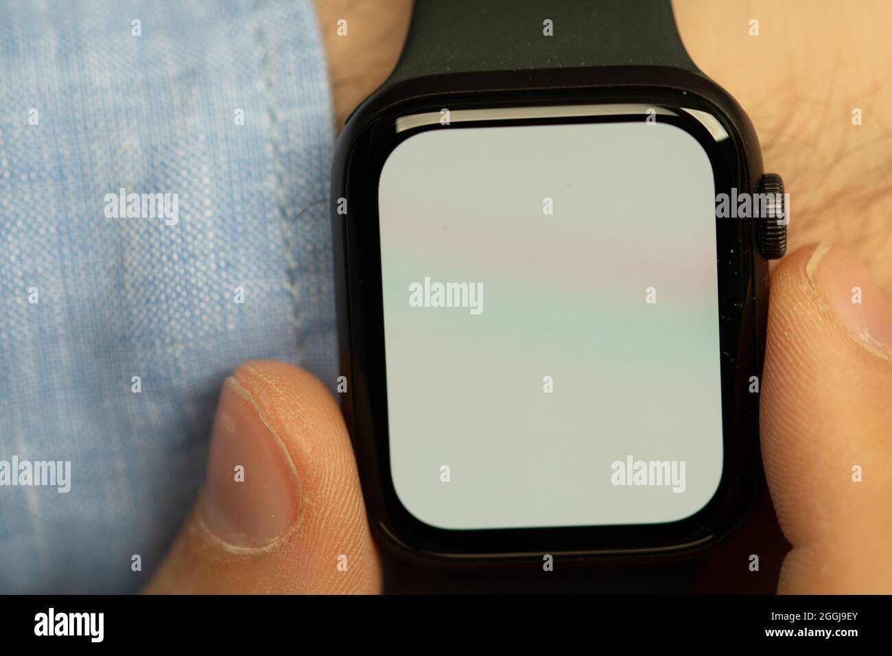 Close up of Businessman's hand looking at hand watch Stock Photo - Alamy