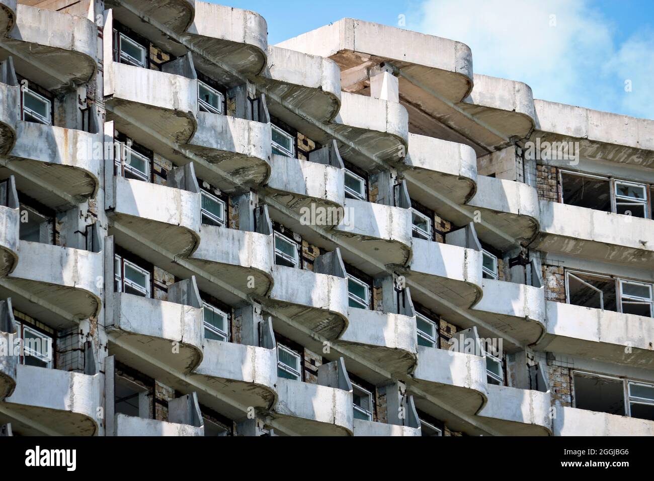 Abandoned crumbling building with semicircular balconies - danger of ...