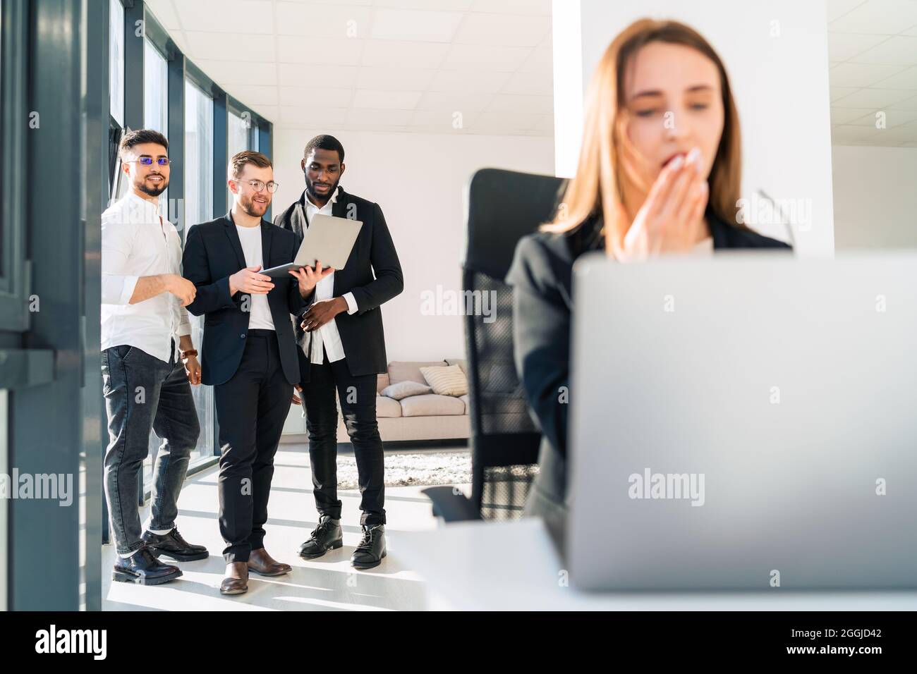 Sleepy female office worker working at the computer Stock Photo - Alamy