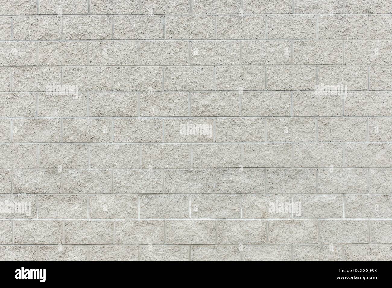 Light grey brick block wall urban texture background Stock Photo - Alamy