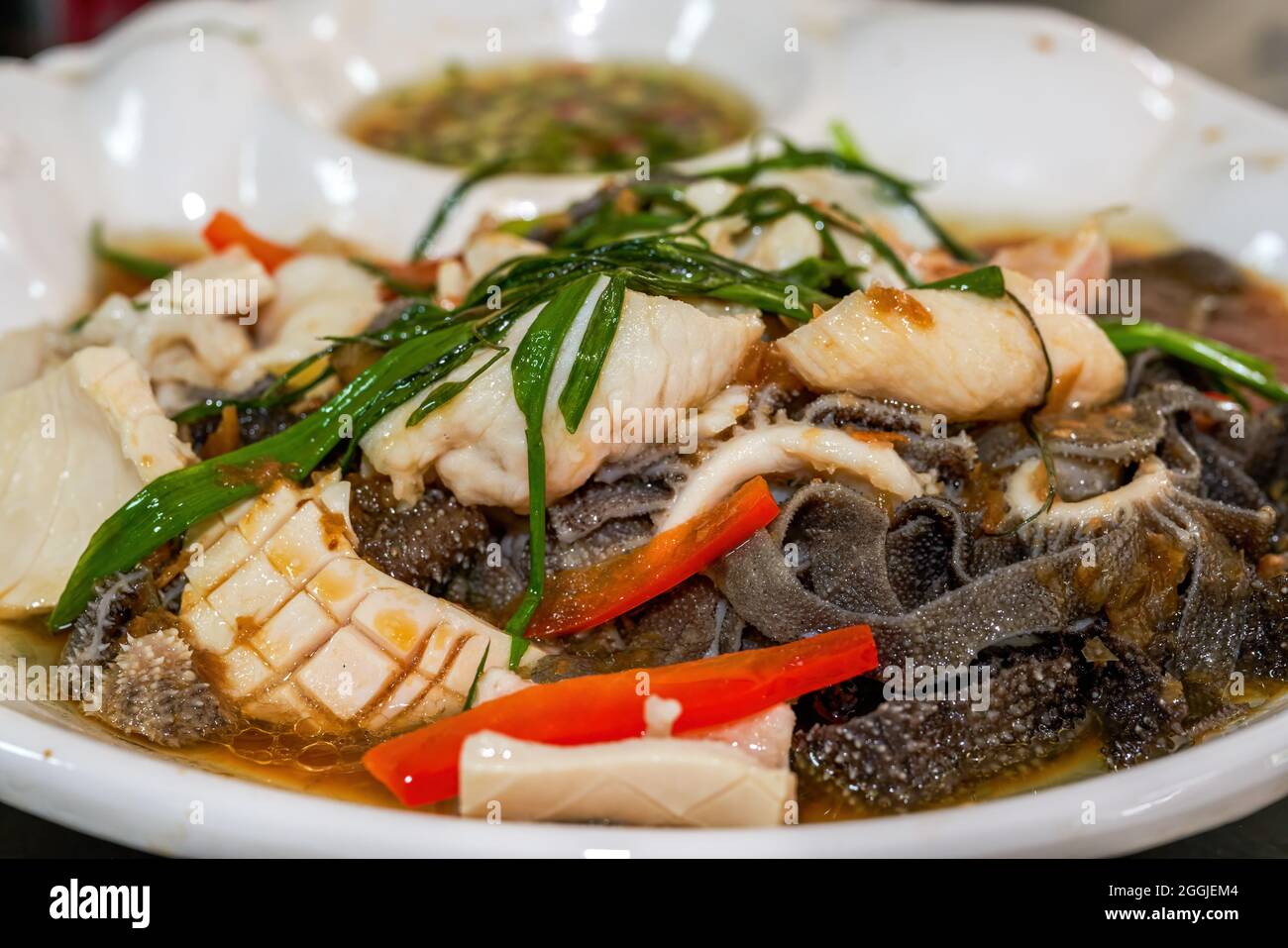 A delicious Chinese dish, boiled tripe and sirloin with film and beef ...