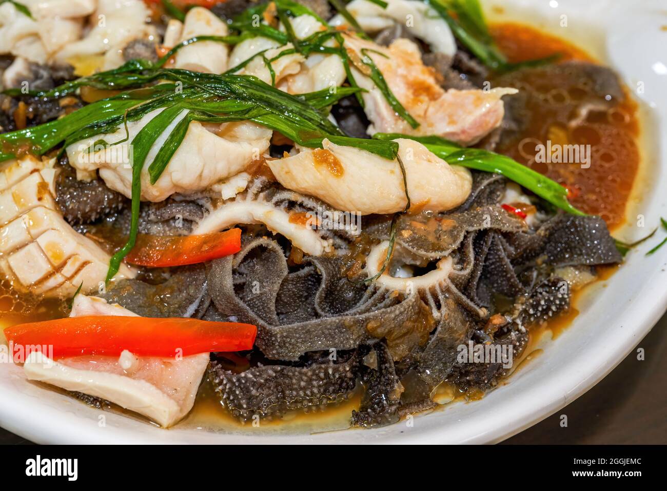 A delicious Chinese dish, boiled tripe and sirloin with film and beef ...