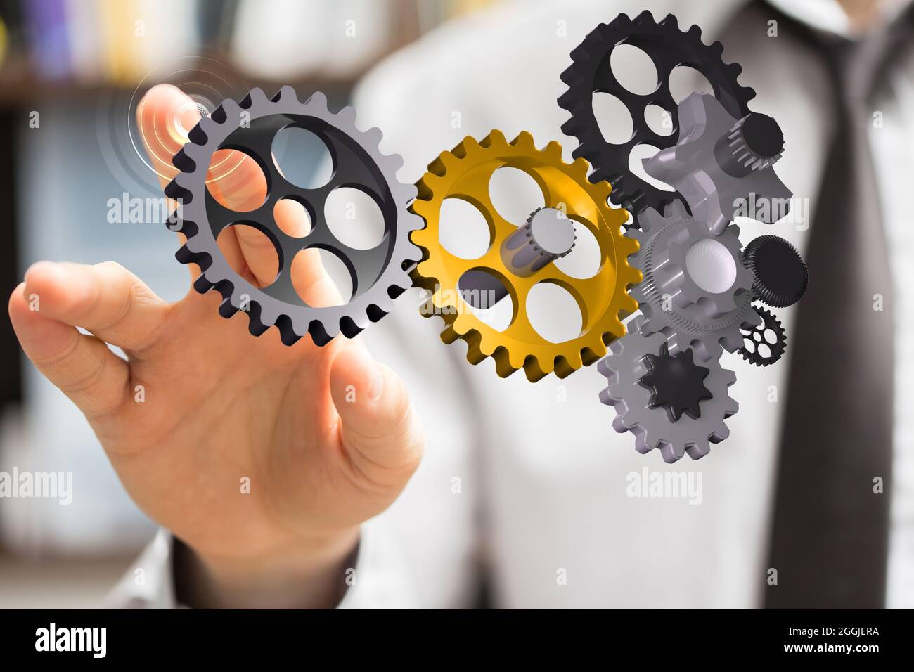 Male's hand pointing to a gear technology setting concept background ...