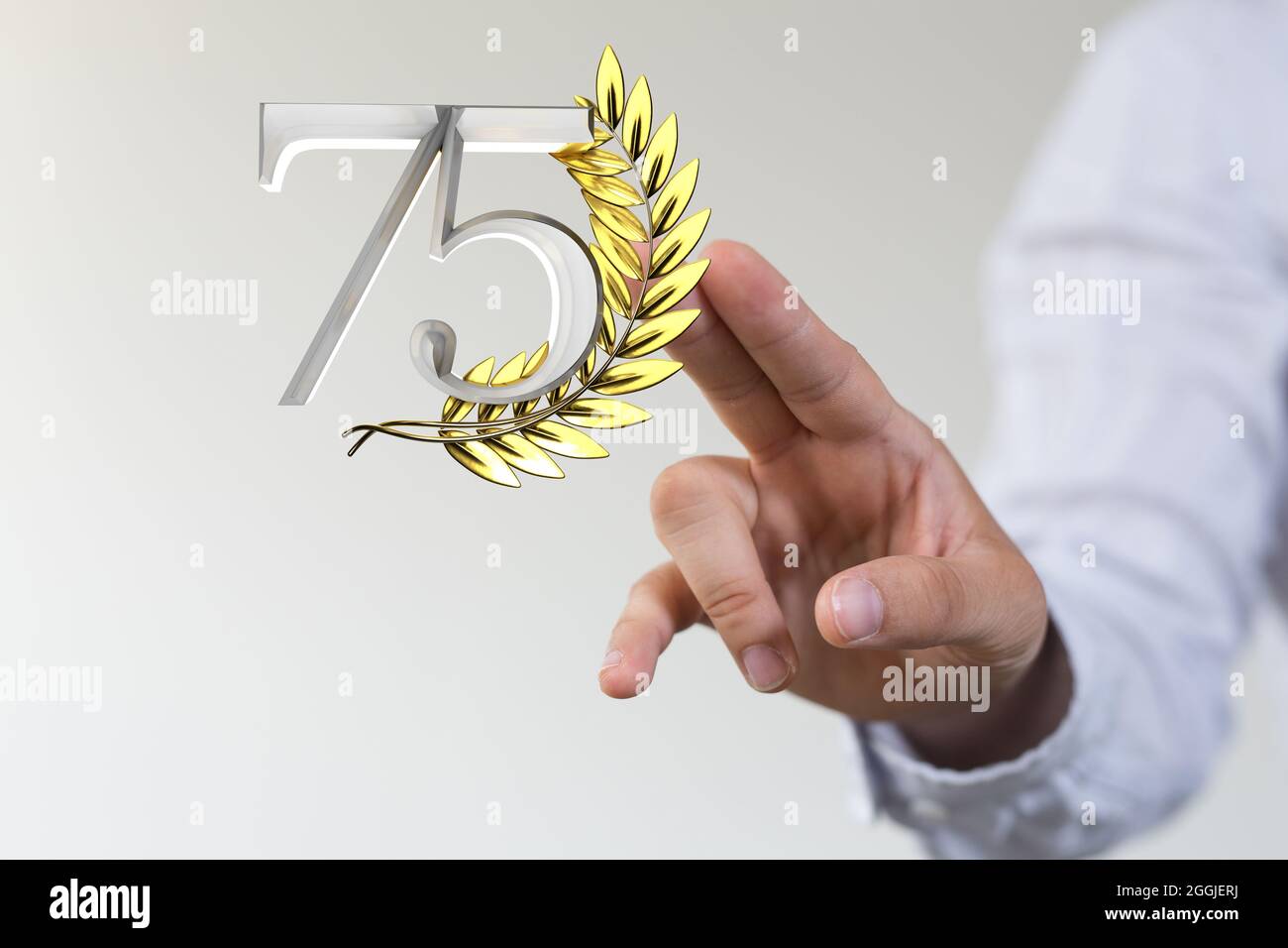 Male's hands holding a 3d rendering illustration of 75 years ...