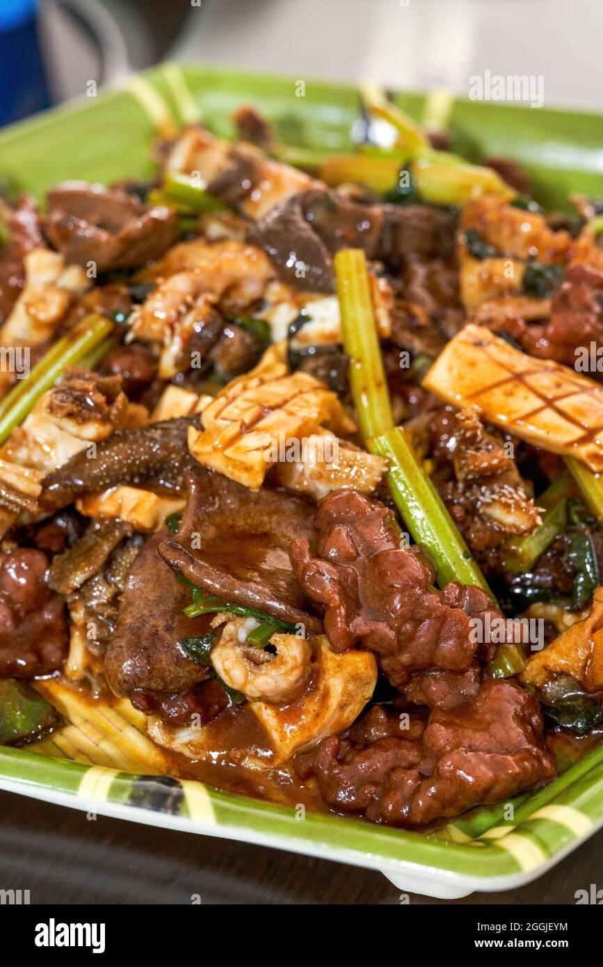 A delicious Chinese dish, stir-fried beef offal and beef Stock Photo ...