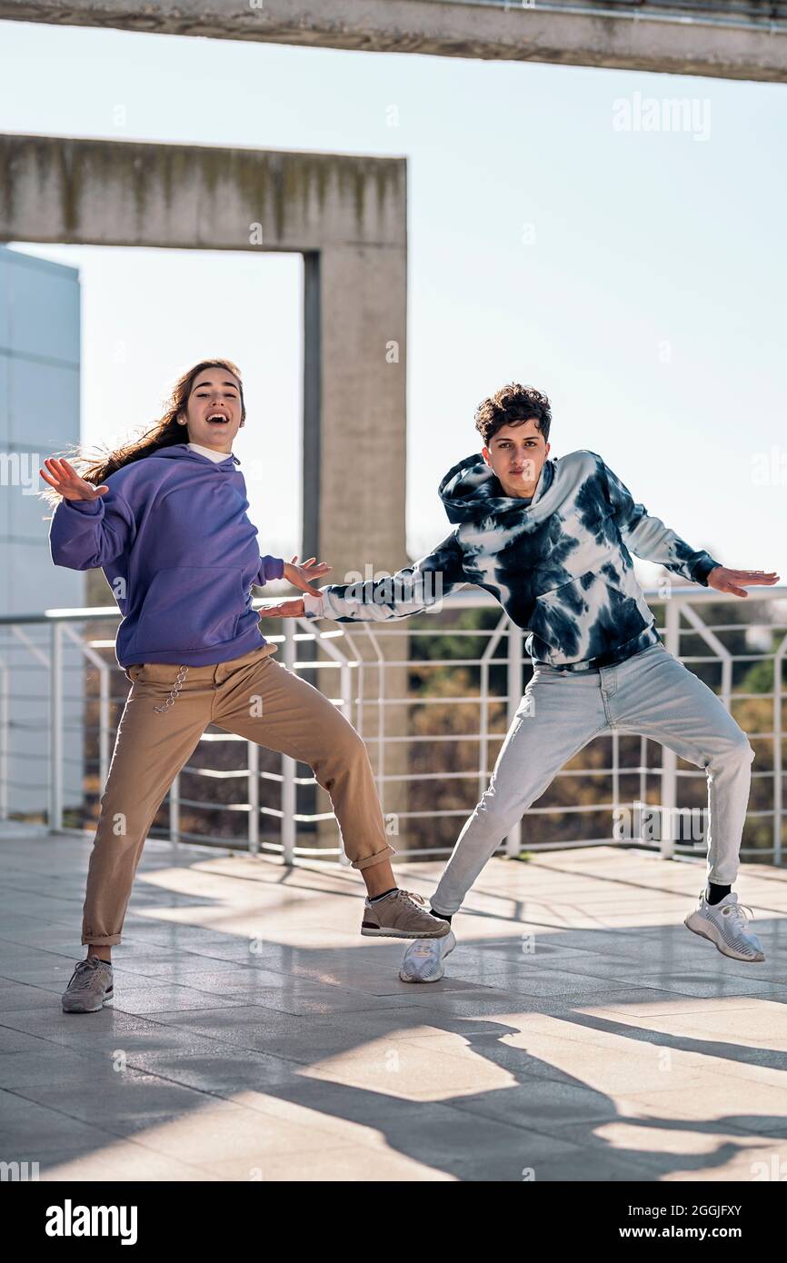 Stock photo of cool girl and her friend doing dance moves and having ...