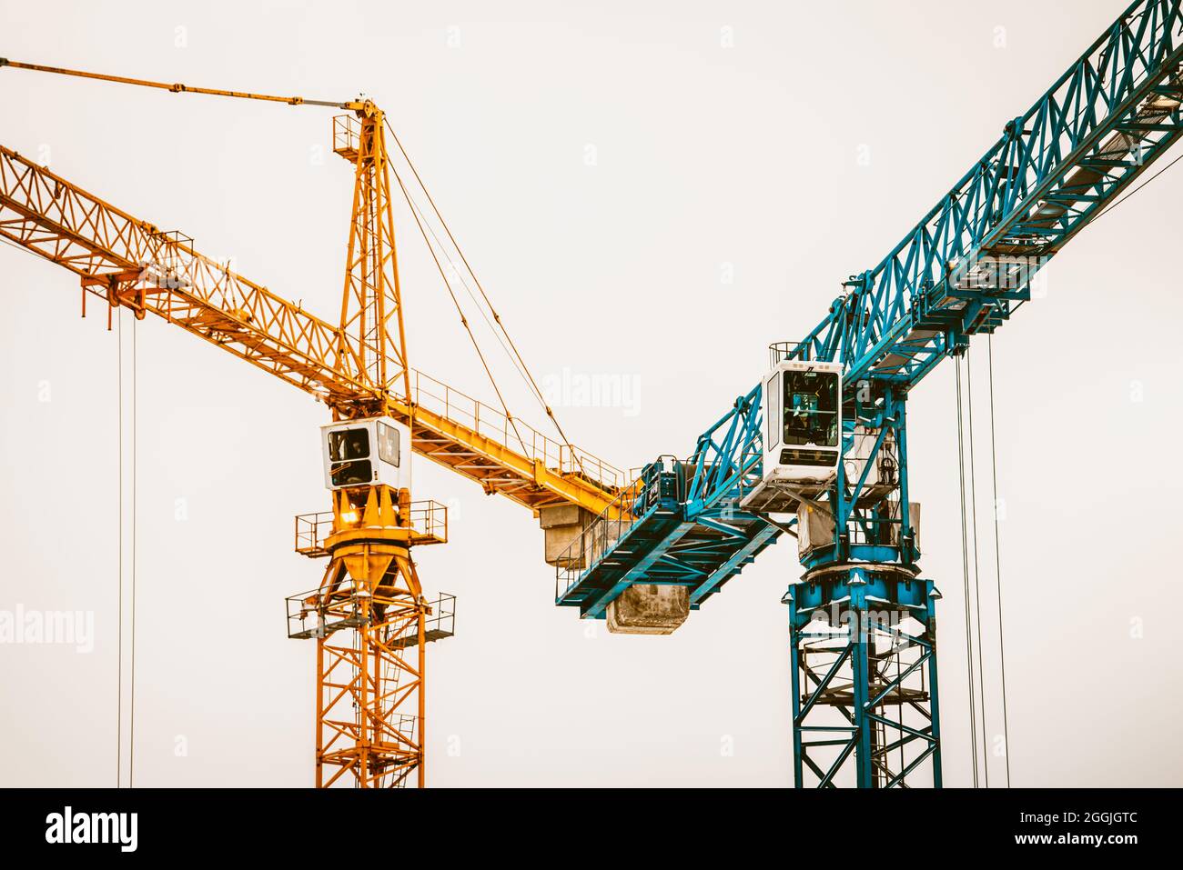 Beautiful Blue and yellow coloroed hammerhead type tower cranes on the ...