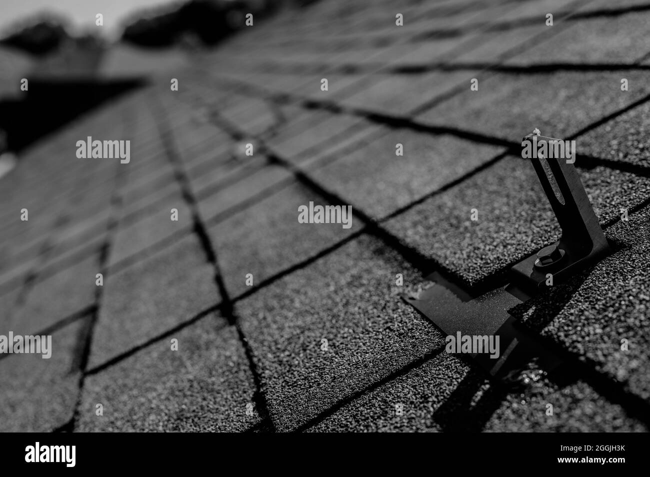 Residential asphalt shingle roof with metal anchors installed for the ...