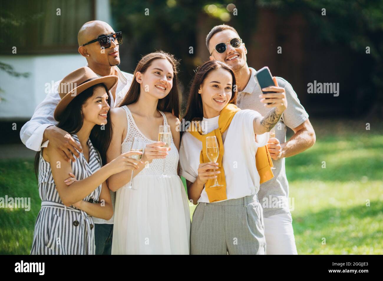 Cropped horizontal portrait of five young people talking selfie on ...