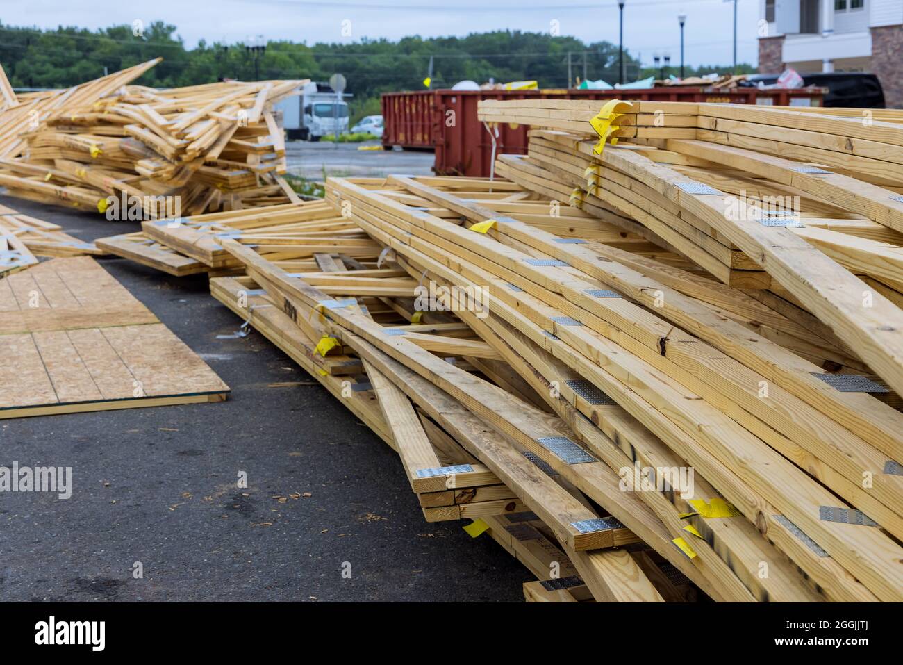 View of on stacker wooden material boards and beams for new house on of ...