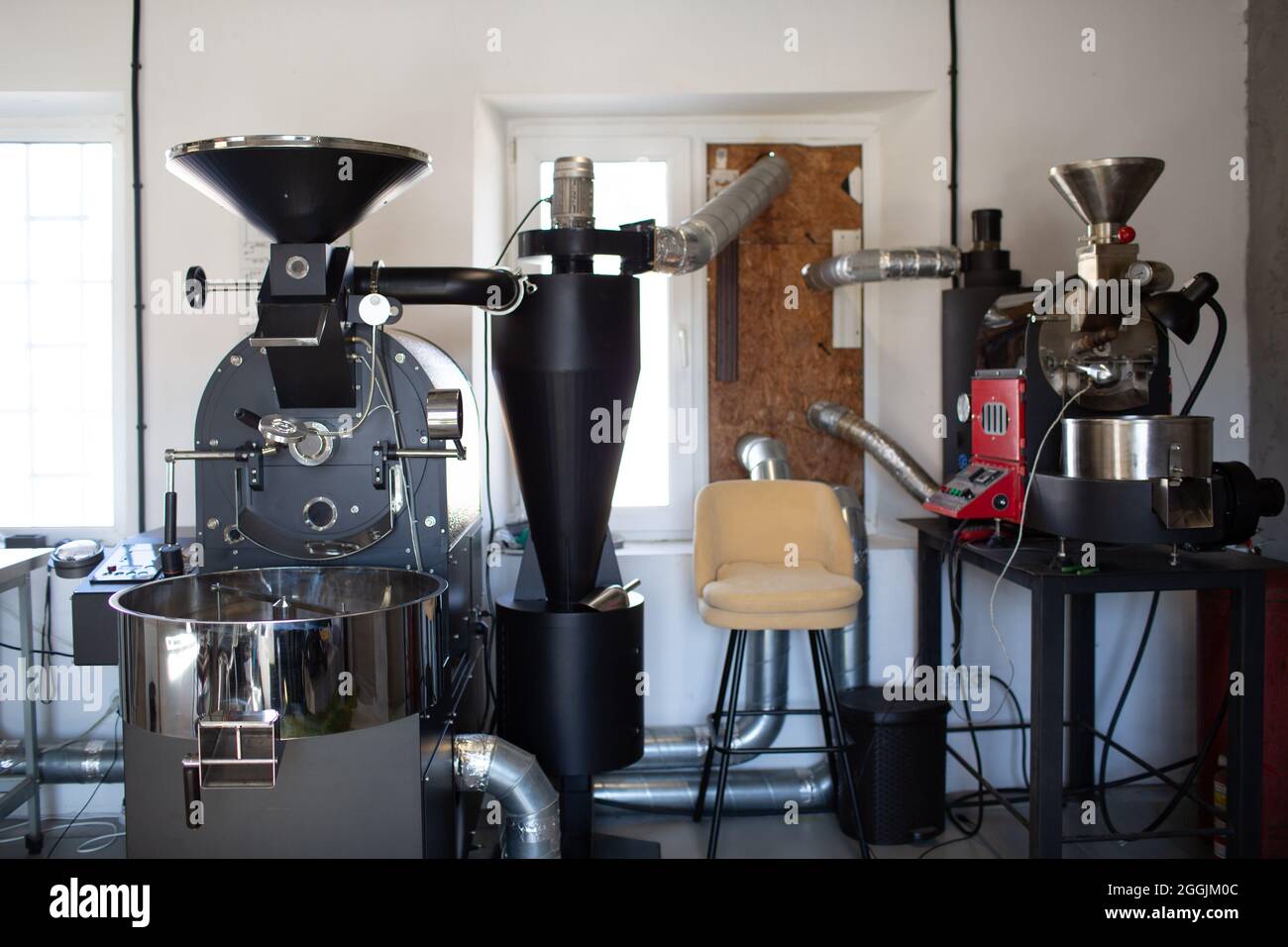 Coffee roaster machine at coffee roasting process Stock Photo - Alamy