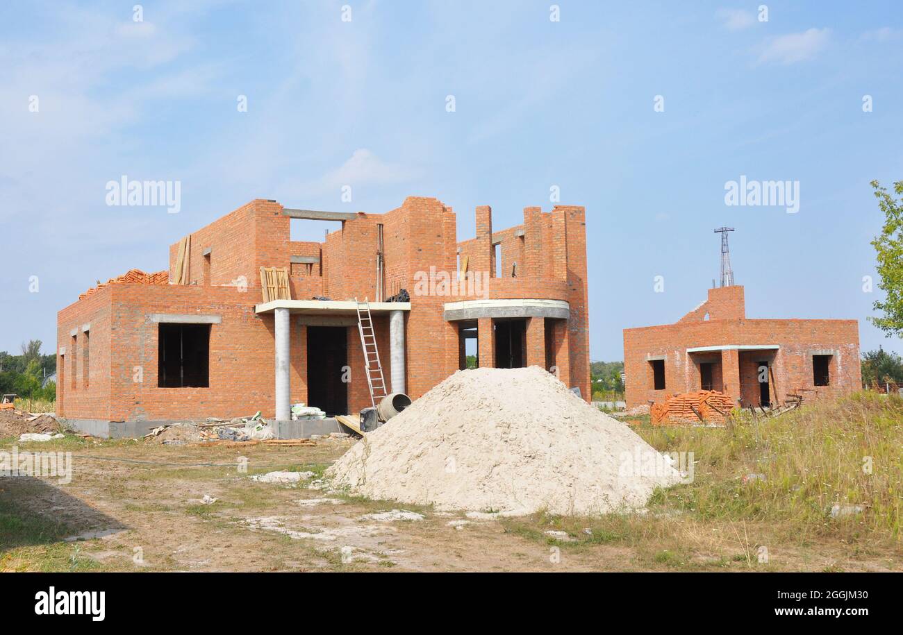 Building residential construction house from bricks. Unfinished House ...