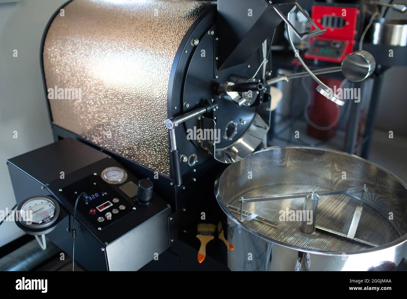 Coffee roaster machine at coffee roasting process Stock Photo - Alamy