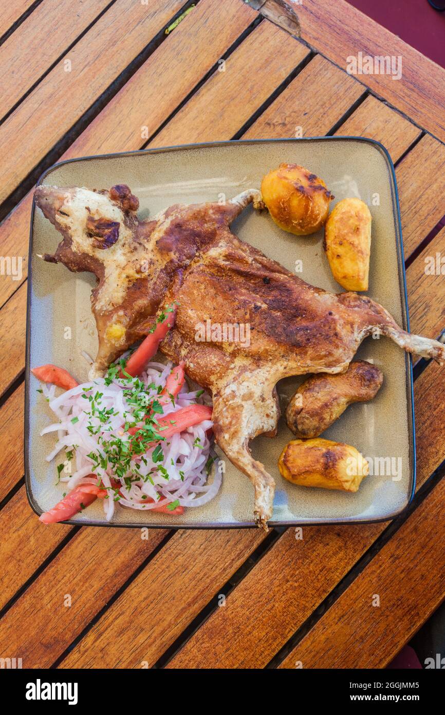Roasted guinea pig, traditional meal in Peru Stock Photo - Alamy