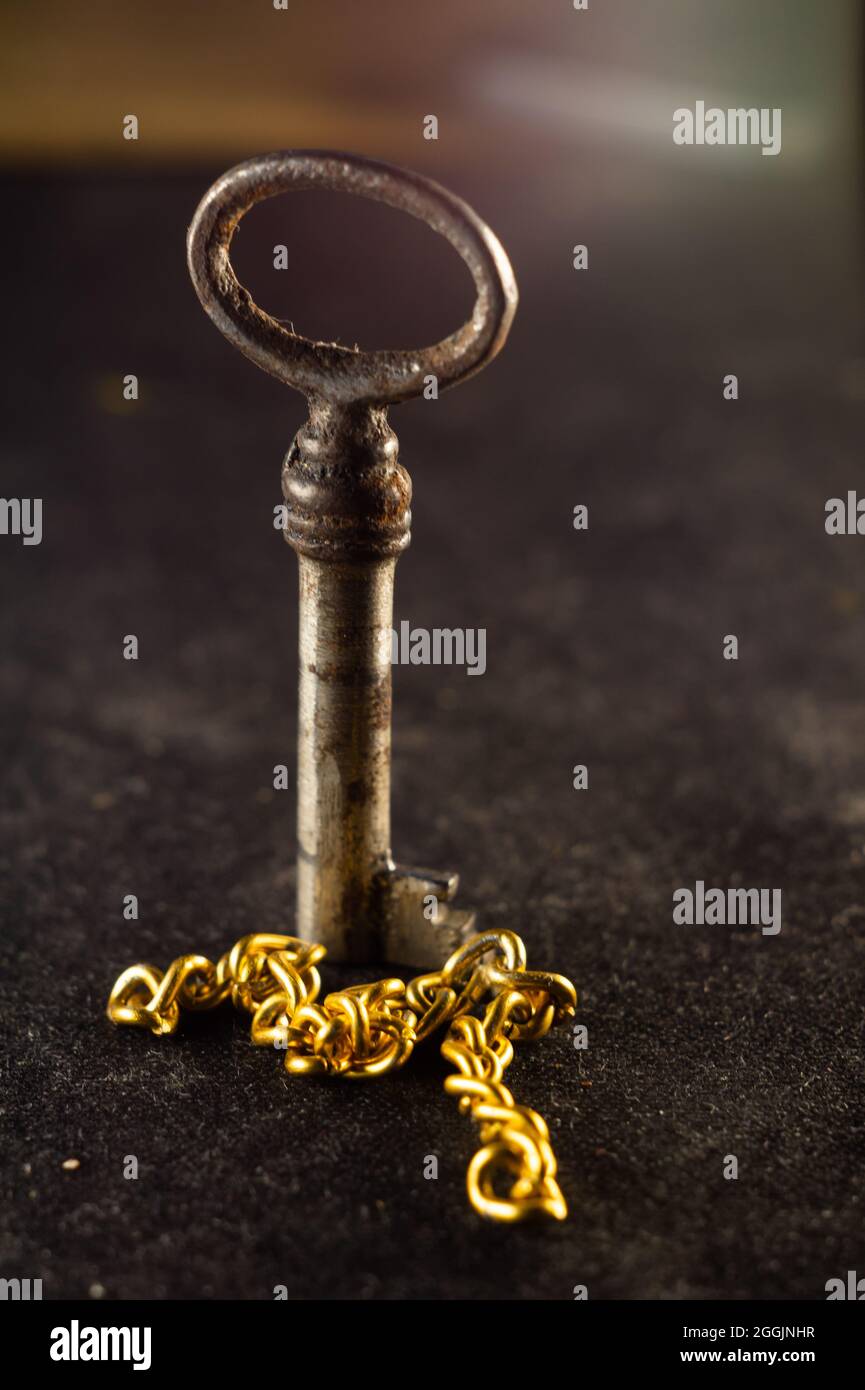 Gold key and chain hi-res stock photography and images - Alamy