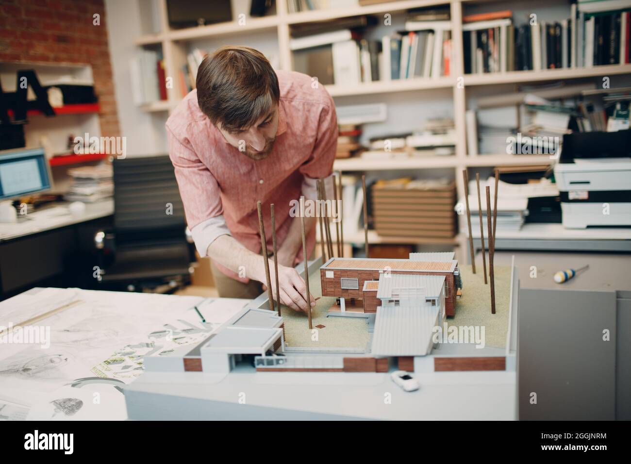 Architect with blueprints and layout design project at office bureau ...