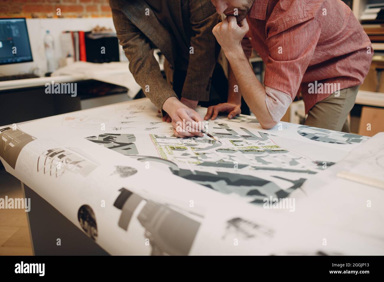 Architect with blueprints and layout design project at office bureau ...