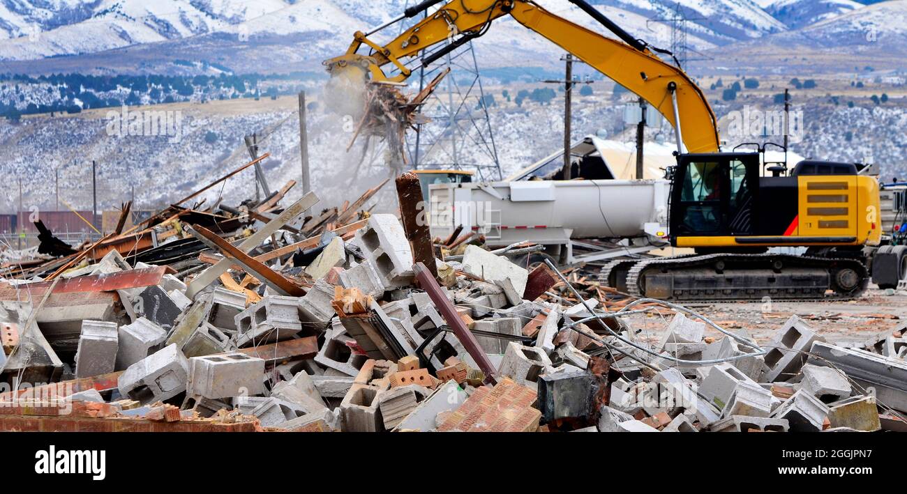 Heavy equipment being used to tear tearing down building construction ... Heavy equipment being used to tear tearing down building construction ...