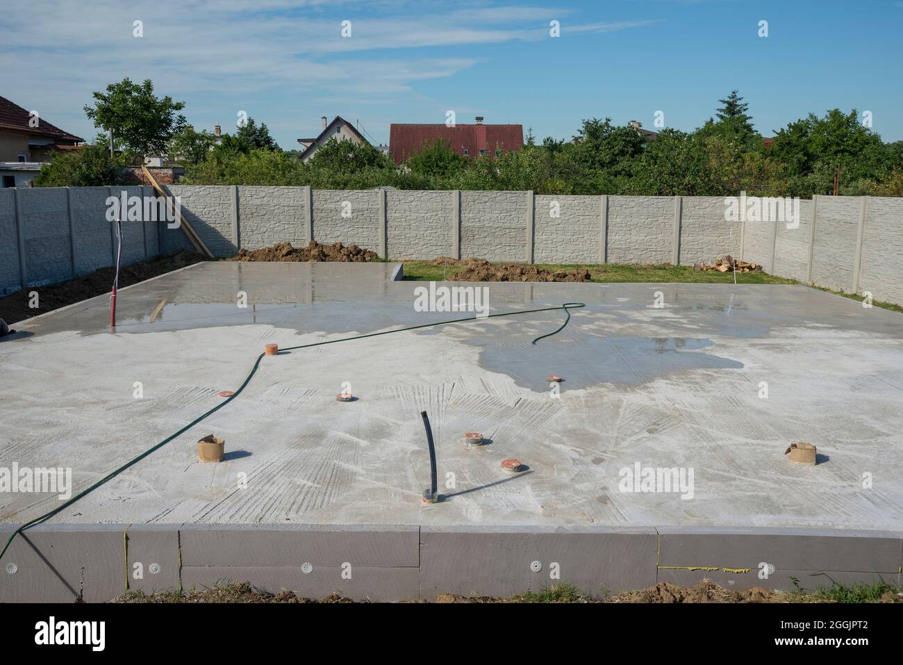 Concrete house foundation must be watered Stock Photo - Alamy
