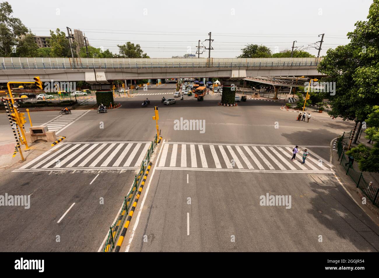 View of a modern wide road in central Delhi with the metro rail track ...