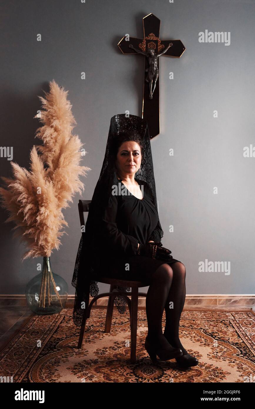 Middle-aged woman on camera in traditional Catholic dress Stock Photo ...