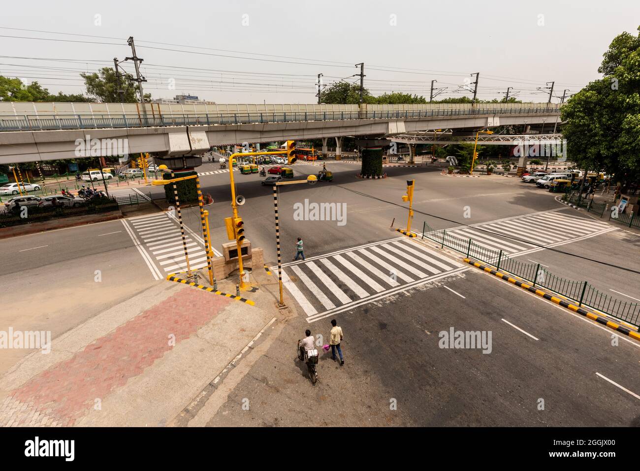 View of a modern wide road in central Delhi with the metro rail track ...