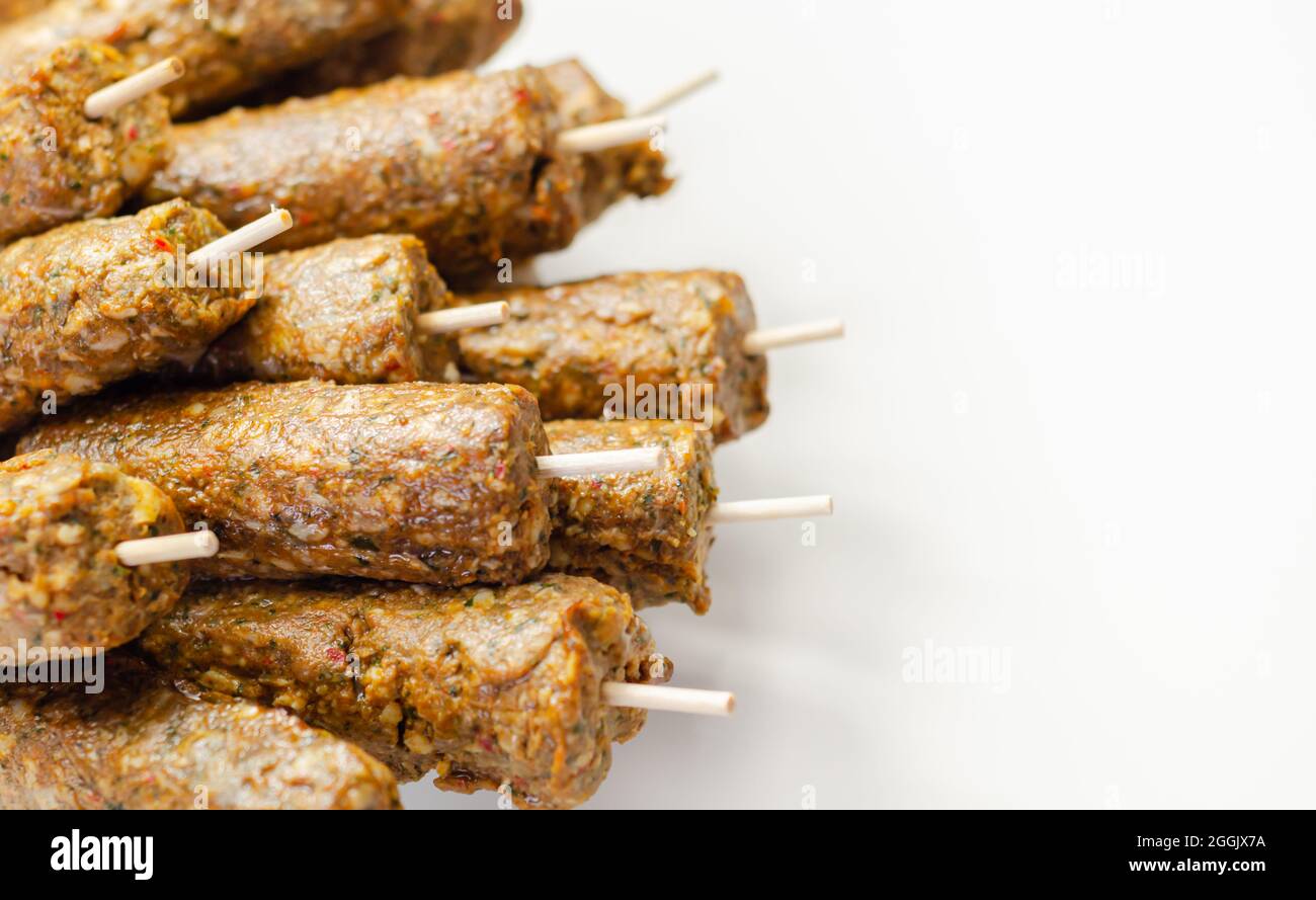 Minced and shaped lamb kebabs with chilli and coriander prepared for ...