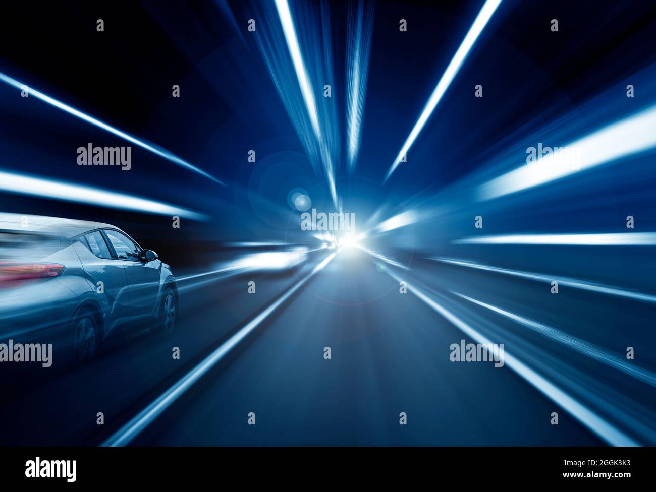 Cars rush through the tunnel in the beams of searchlights Stock Photo ...