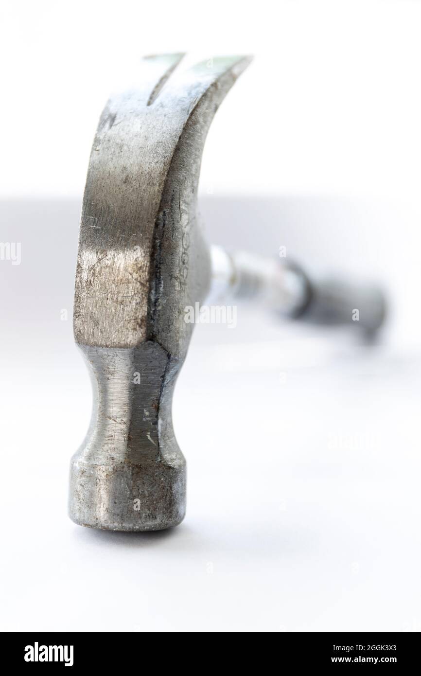 A close up art studio isolated portrait of a metal hammer lying on the ...