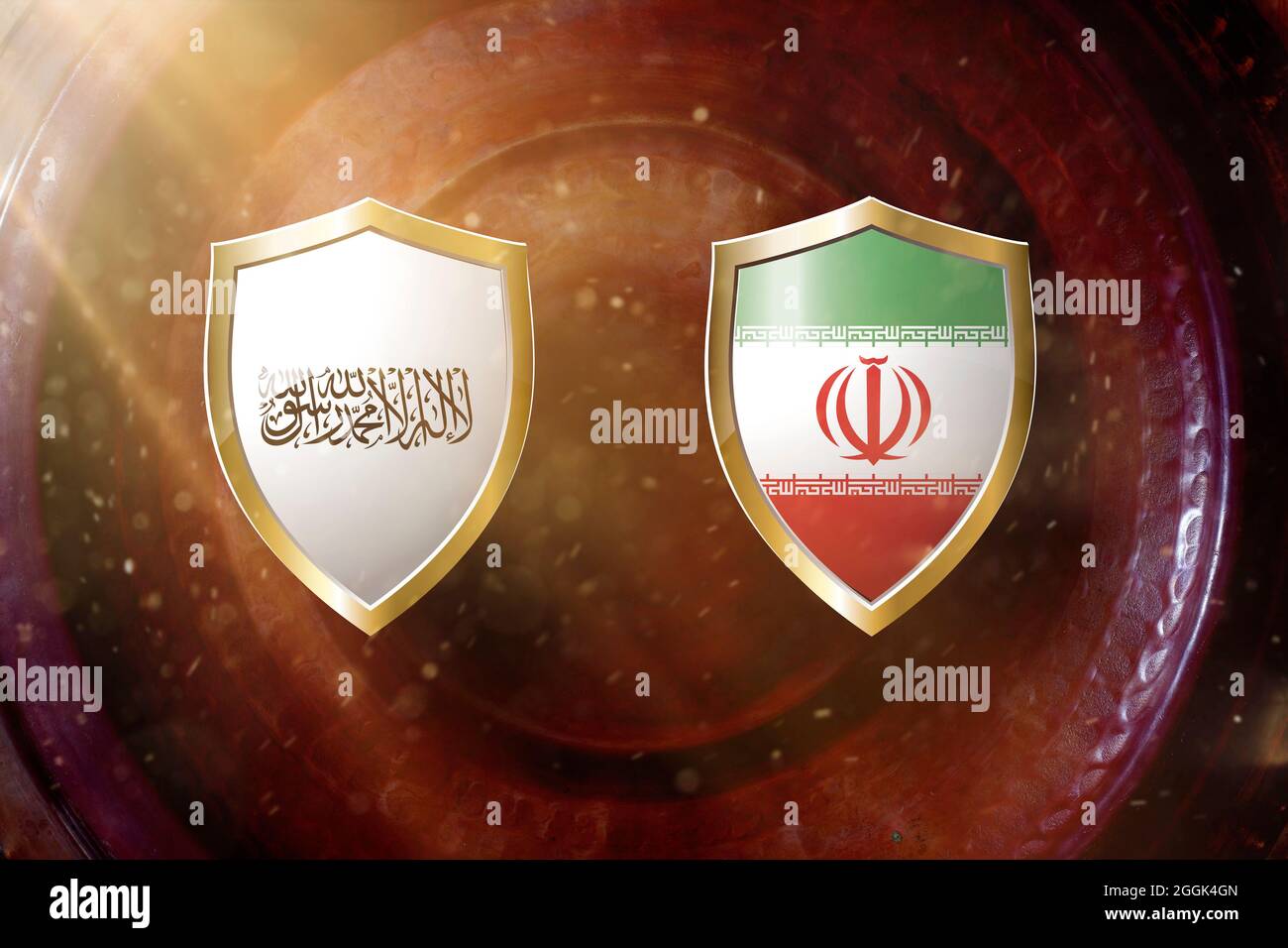 taliban and iran flag in golden shield on copper texture background ...