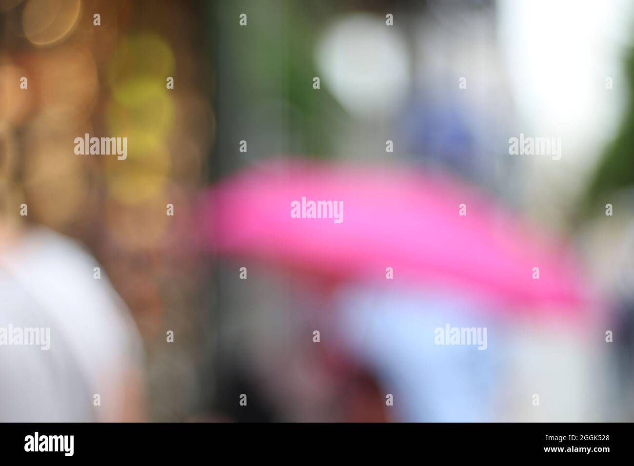 Umbrella in the pedestrian zone Stock Photo - Alamy