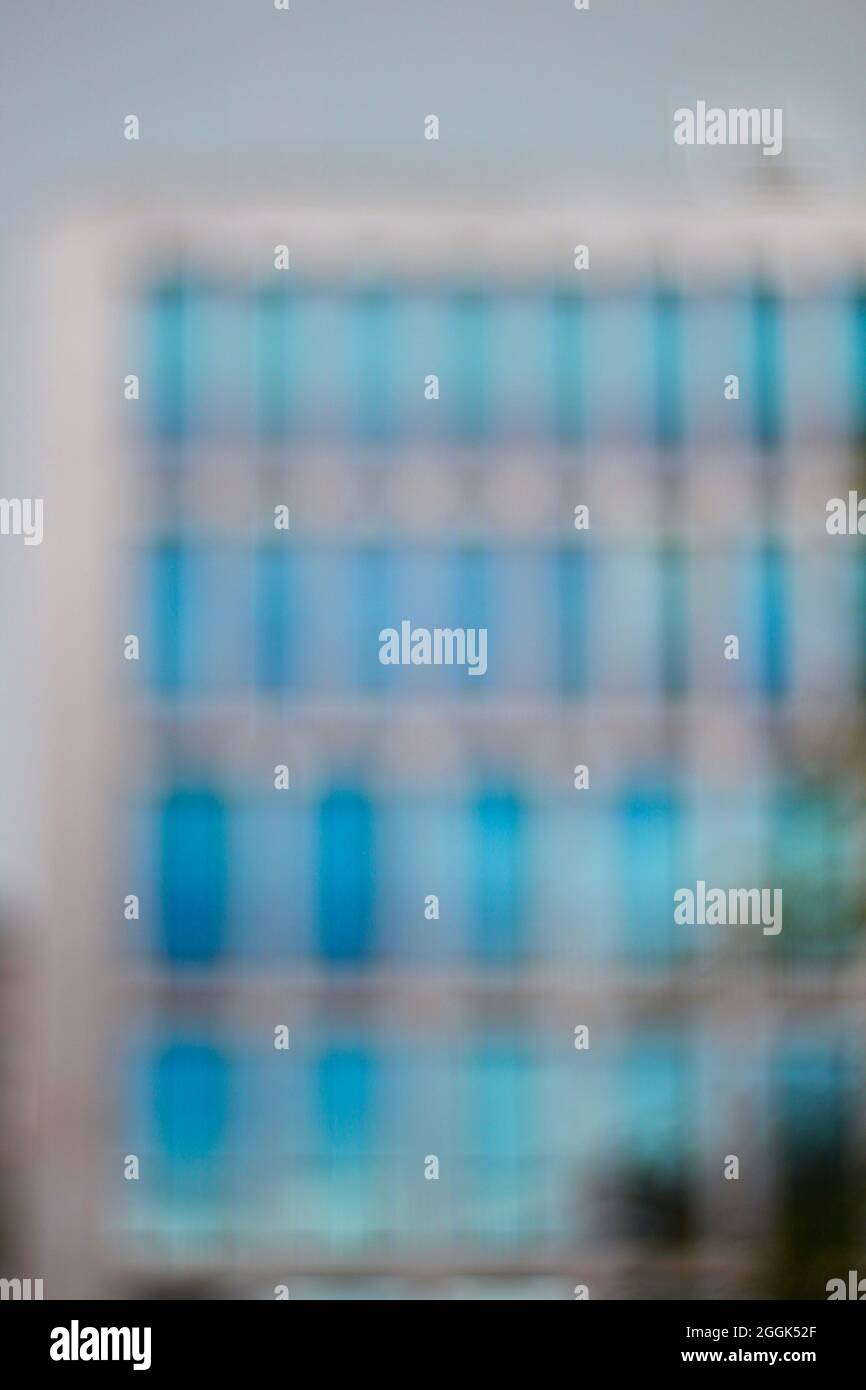 Commercial building with blue, mirrored windows Stock Photo - Alamy