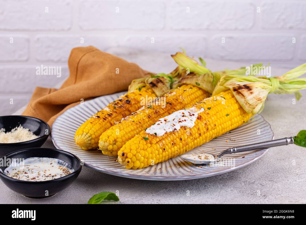 Grilled corn cobs with parmesan cheese Stock Photo - Alamy