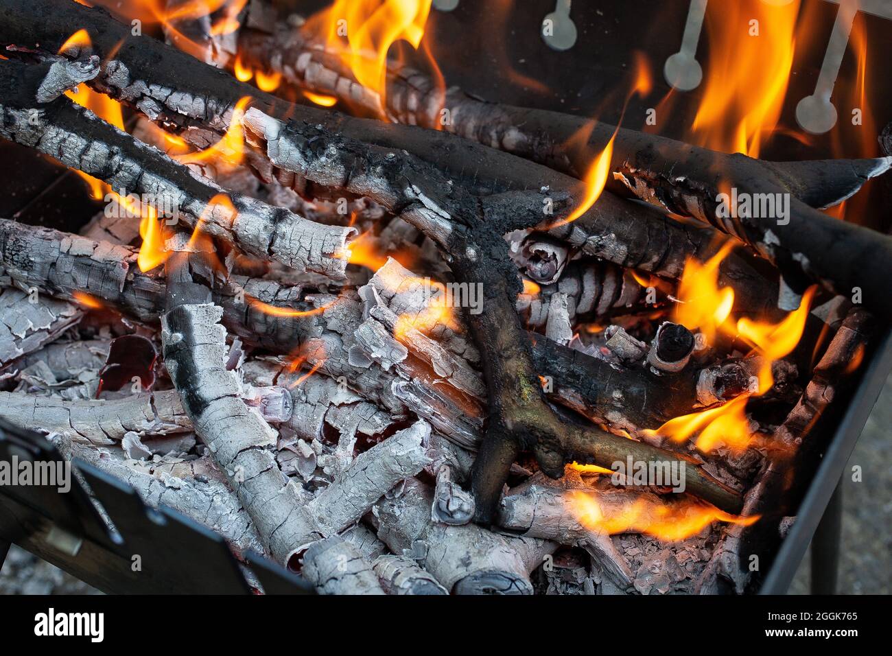 Closeup of flames and burning firewood turning to ashes Stock Photo - Alamy