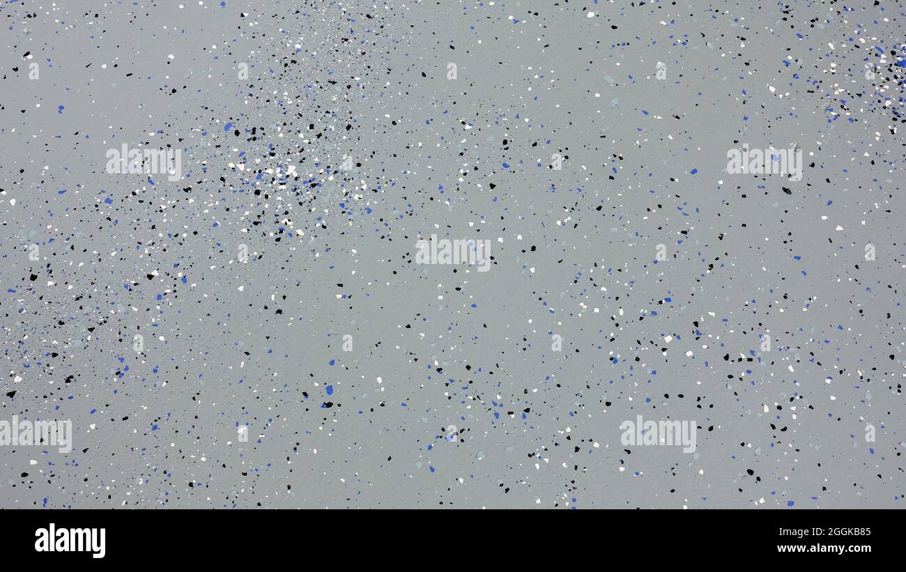 A freshly painted with a gray epoxy finish sprinkled with blue, black ...