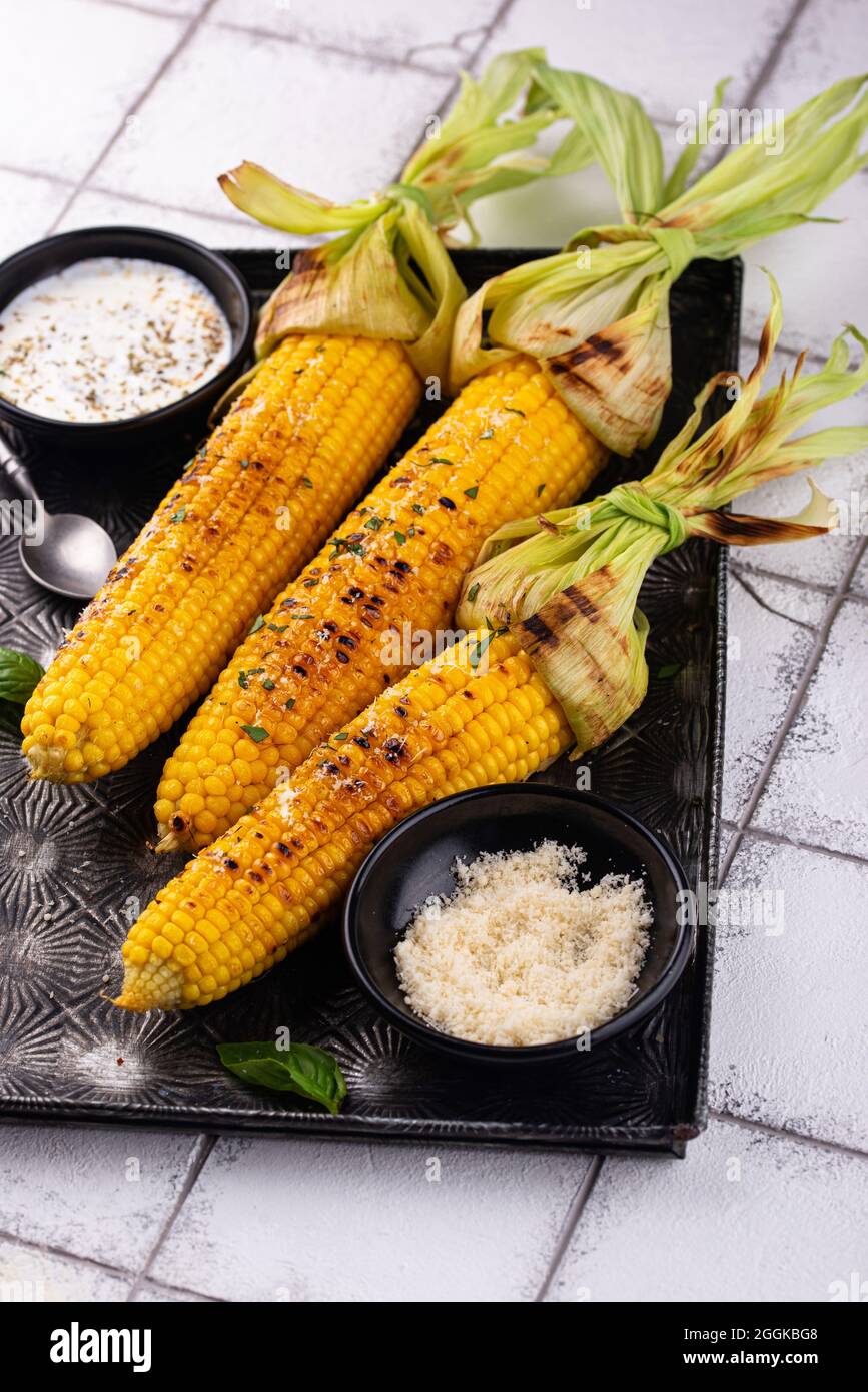 Grilled corn cobs with parmesan cheese Stock Photo - Alamy