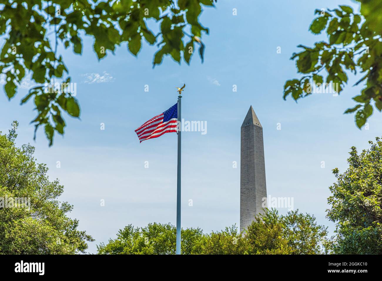 National flag and George Washington Monument, National Mall, Washington ...
