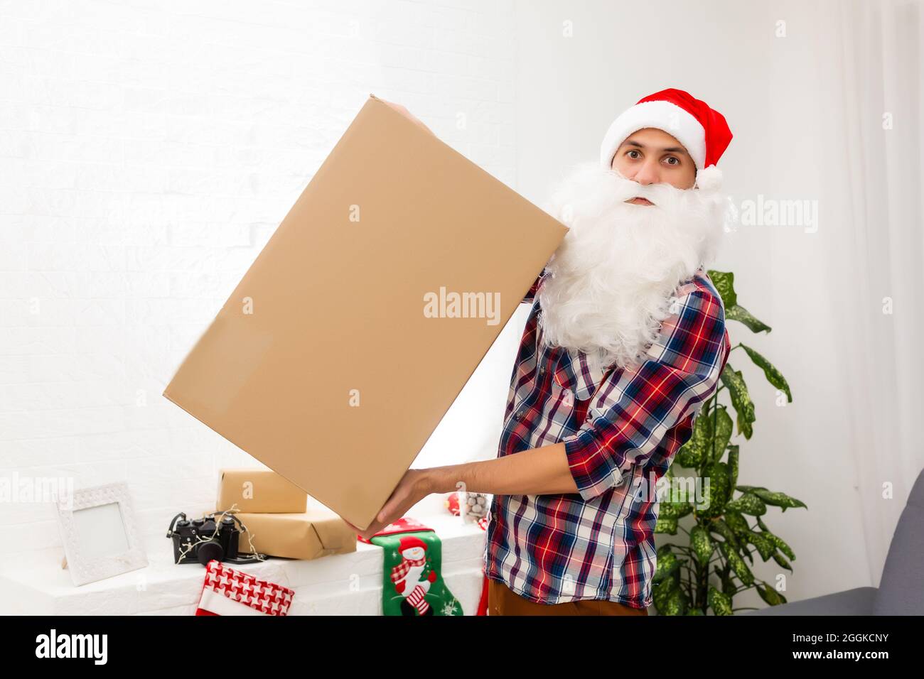 santa claus carrying a cardboard box on white background Stock Photo ...