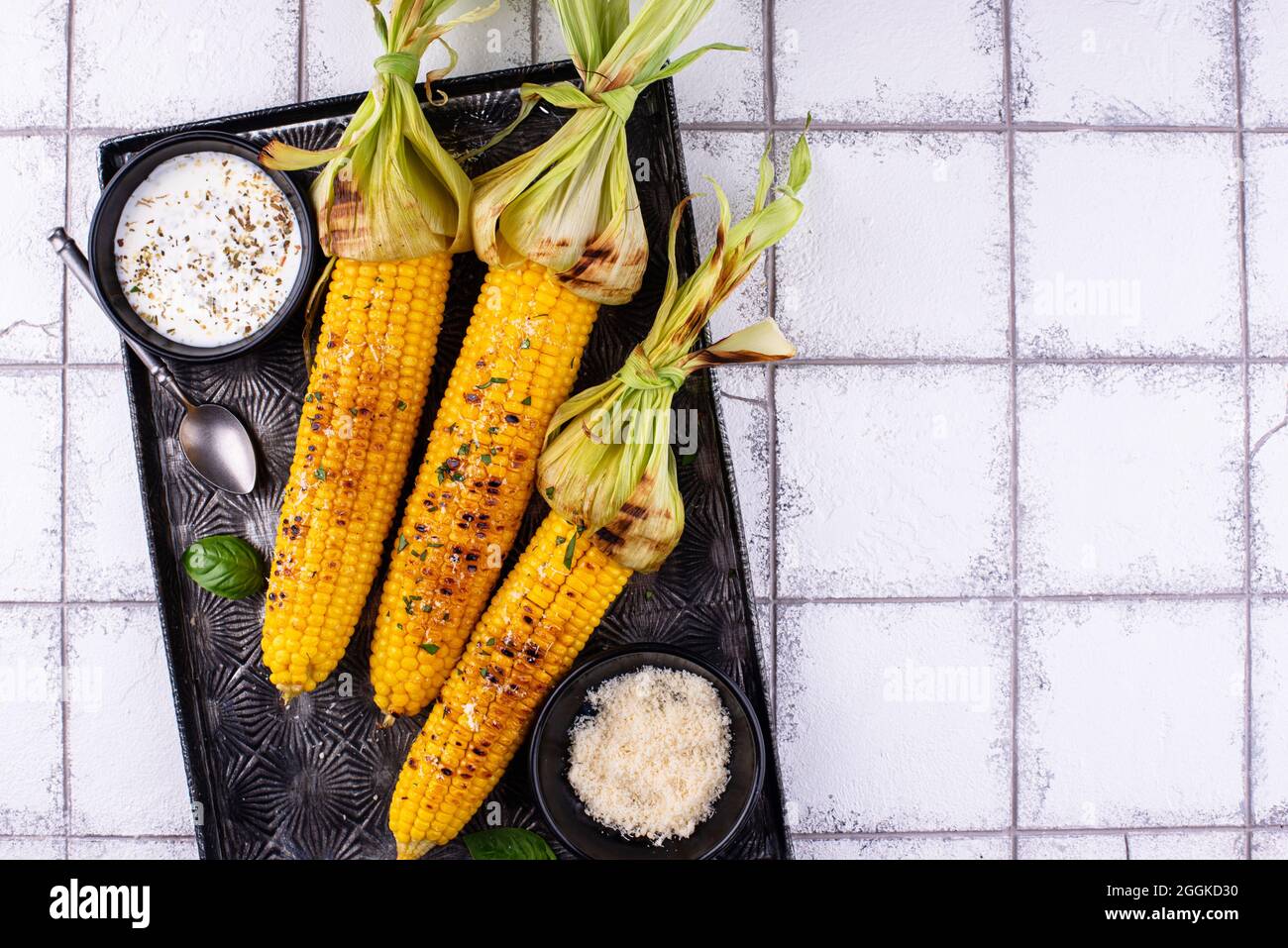 Grilled corn cobs with parmesan cheese Stock Photo - Alamy