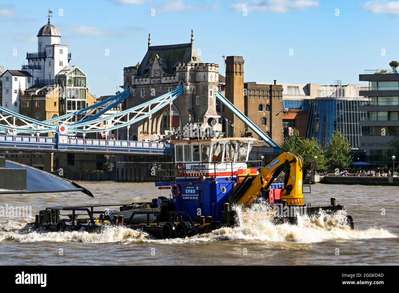 London, England - August 2021: Industrial barge with dredging equipment ...