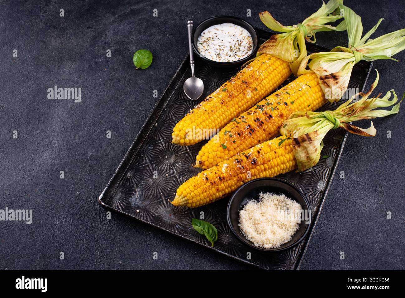 Grilled corn cobs with parmesan cheese Stock Photo - Alamy