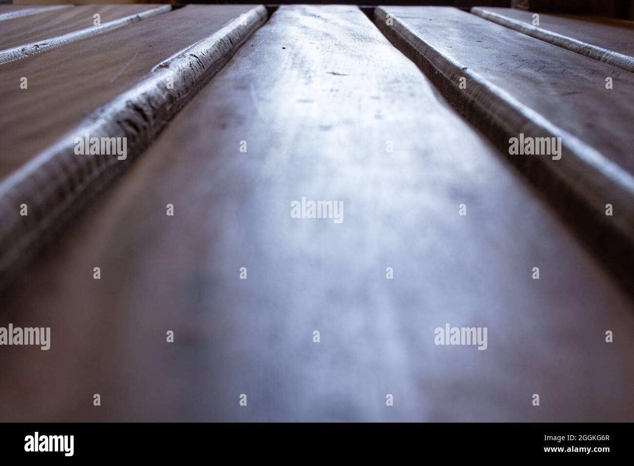 Dark colored wood texture, with selective focus on the central part ...