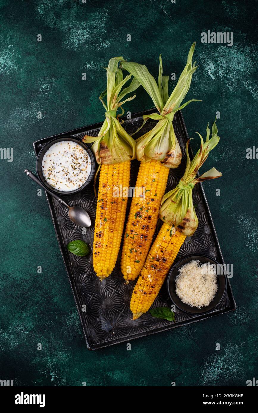 Grilled corn cobs with parmesan cheese Stock Photo - Alamy