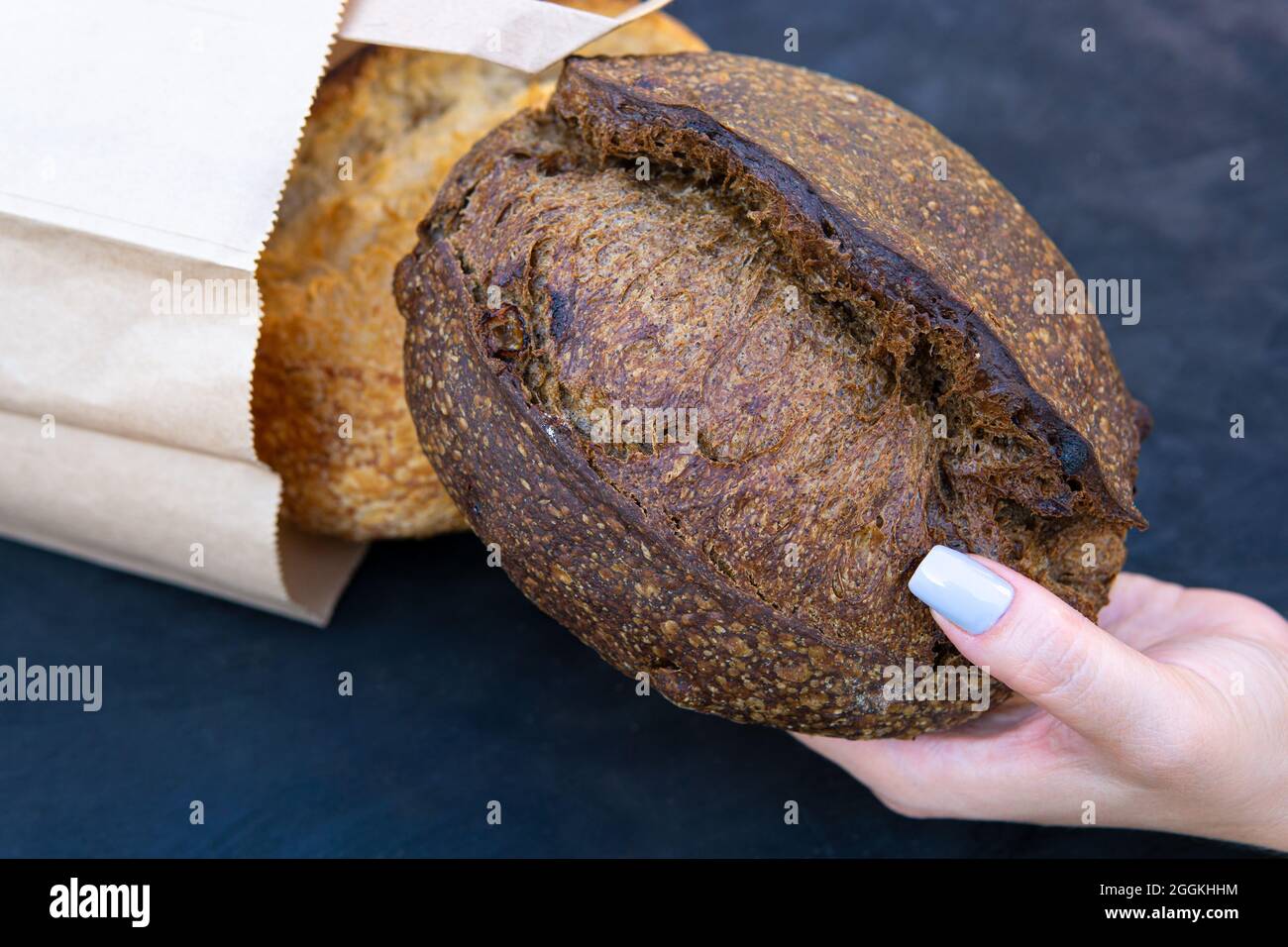 Female hand taking freshly baked hi-res stock photography and images ...