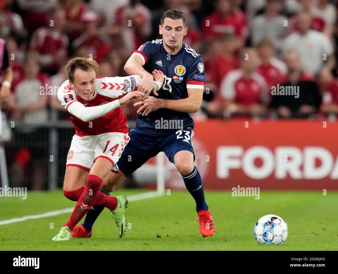 Denmark's Mikkel Damsgaard and Scotland's Kenny McLean (right) battle ...