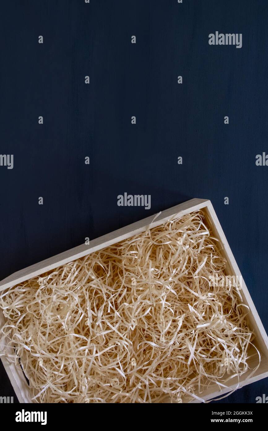 Straw into storage box for wine on the blue background, delivery ...