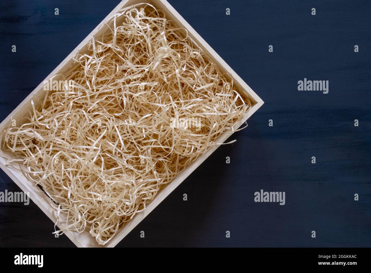 Straw into storage box for wine on the blue background, delivery ...