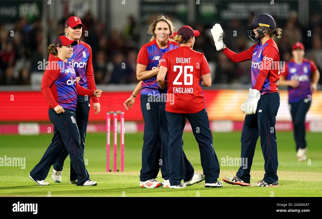 England's Nat Sciver (centre) celebrates taking the wicket of New ...